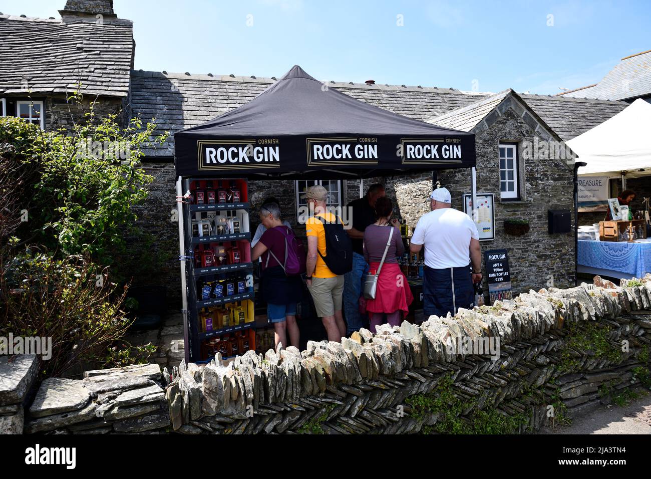 Rock Gin serving up a taster in Tintagel Cornwall England uk Stock ...
