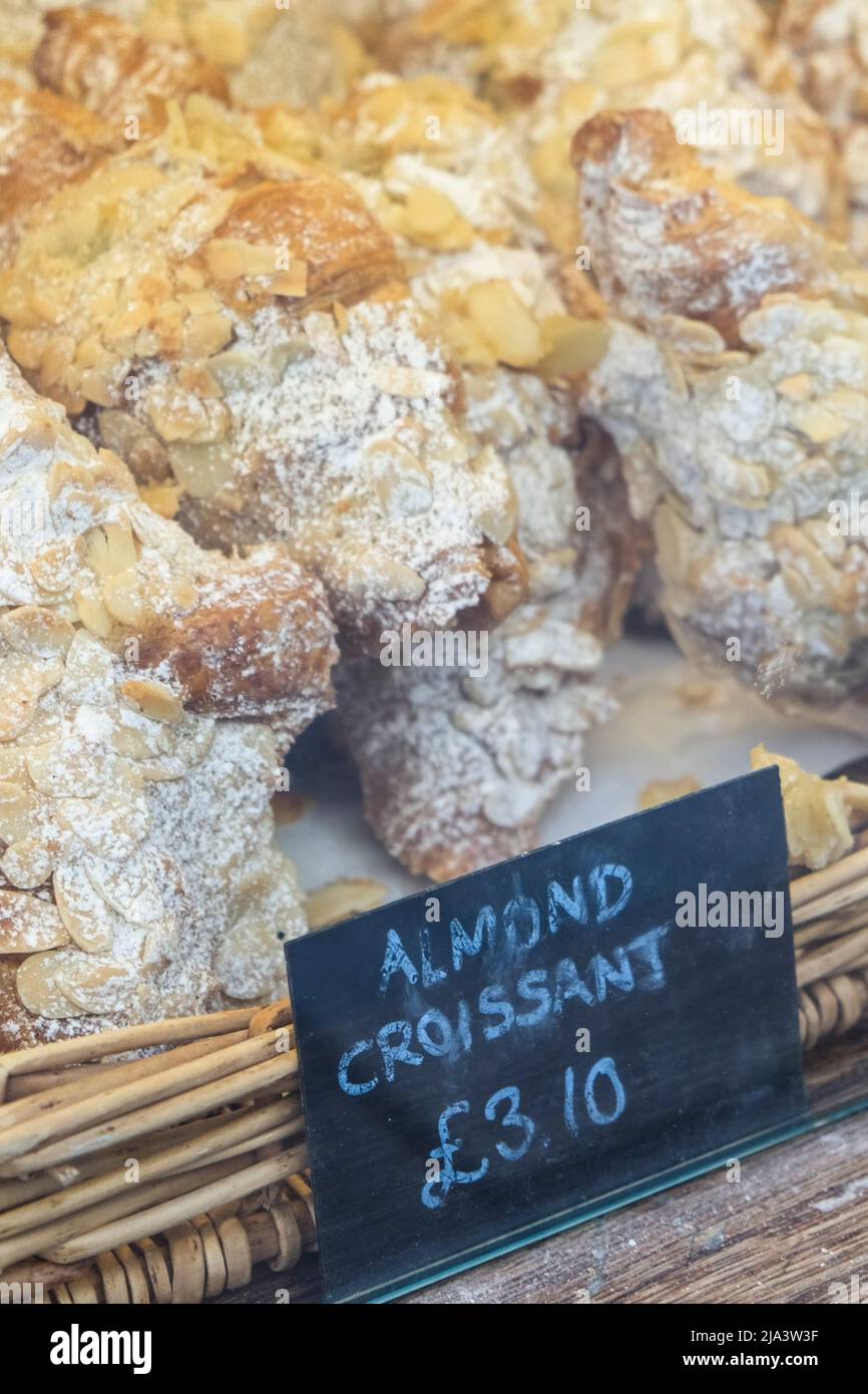 Almond Croissants in a window display at Bertinet Bakery in Bath UK ...