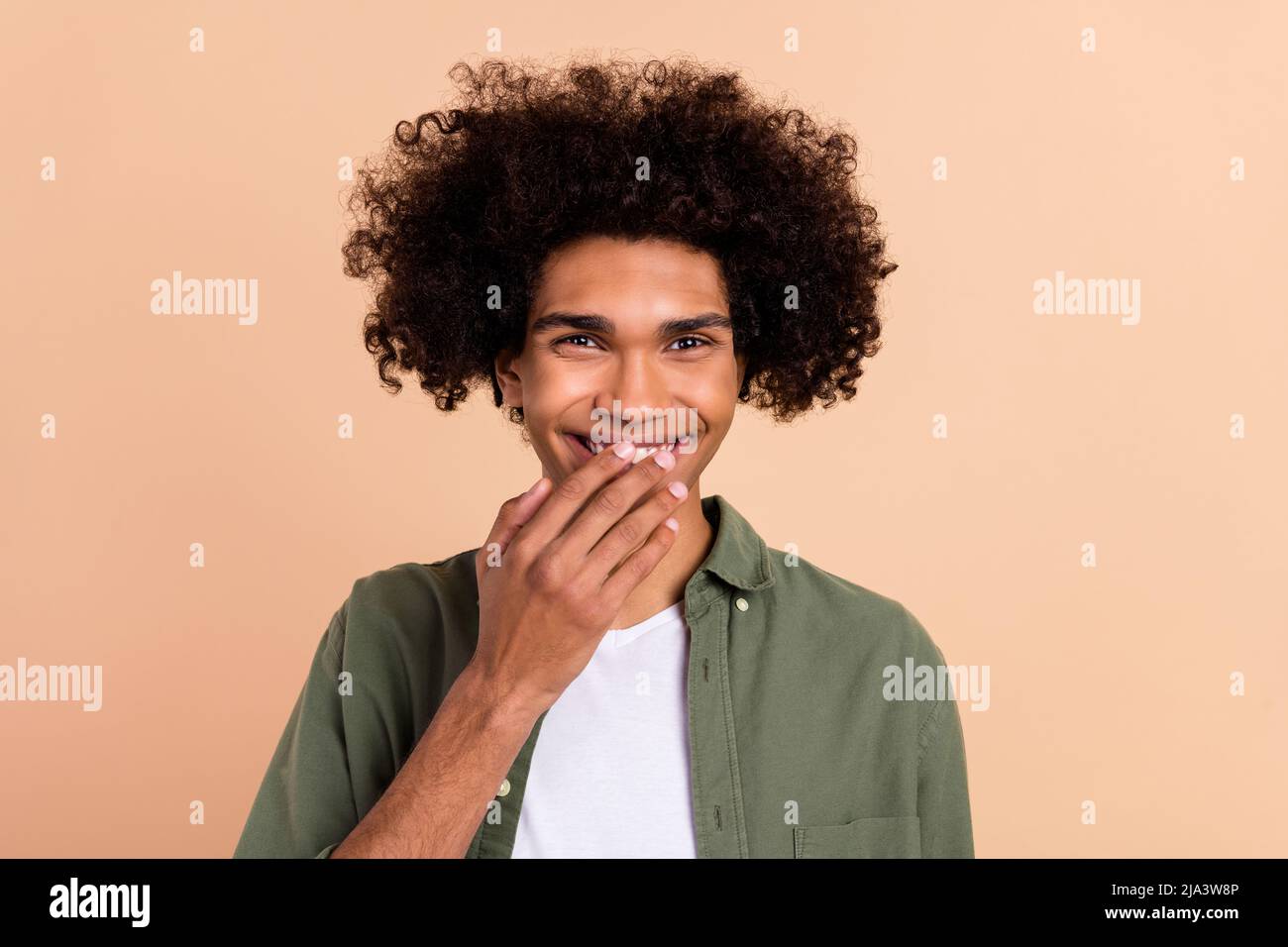 Portrait of attractive cheerful cute guy with chevelure laughing good ...
