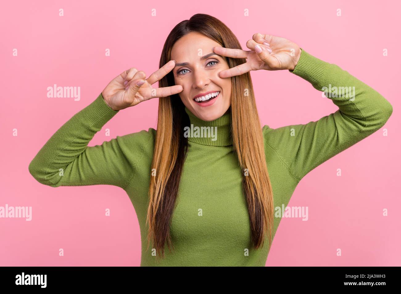 Photo of optimistic excited lady enjoying weekend make v sign near eyes ...