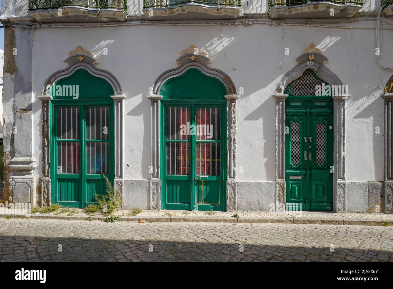 OLHAO, Algarve, Portugal : Building with green doors and bars on ...