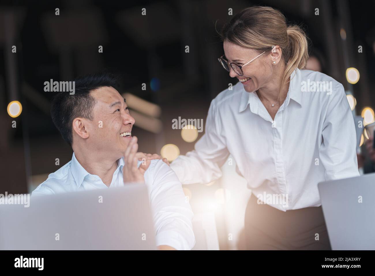 Picture of excited happy emotional colleagues in office working with ...