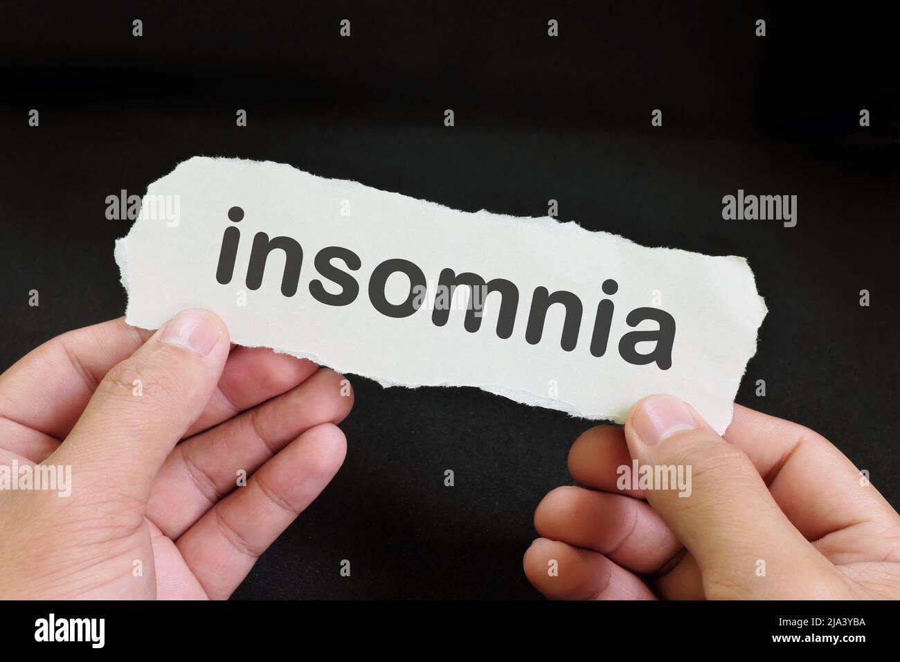 Insomnia sleep disorder diagnosis concept. Hand holding paper with ...