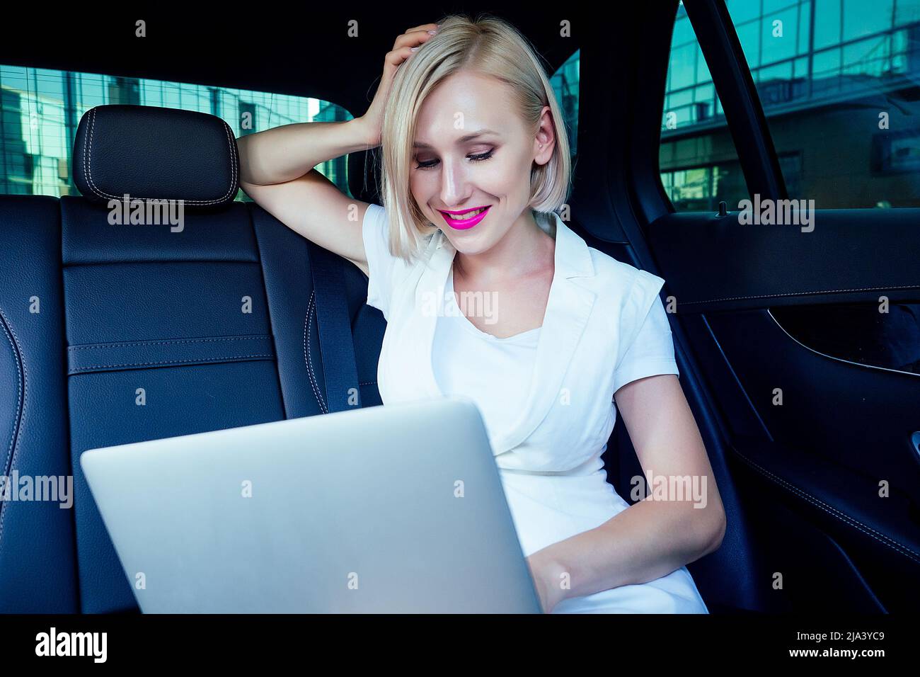 portrait of beautiful young successful blonde short haircut business ...