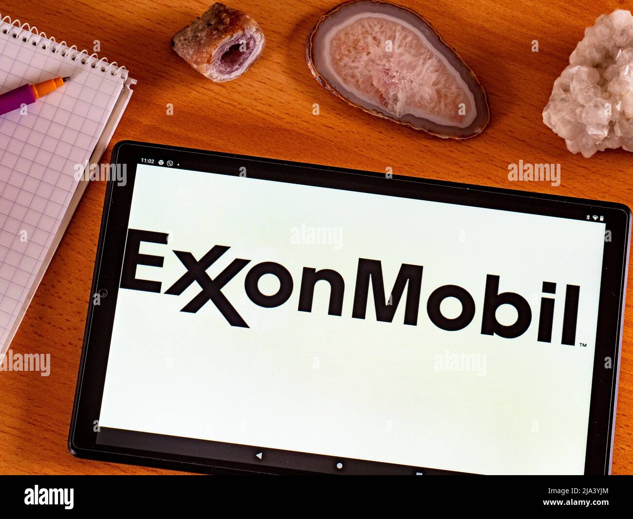 In this photo illustration Exxon Mobil Corporation logo seen displayed ...