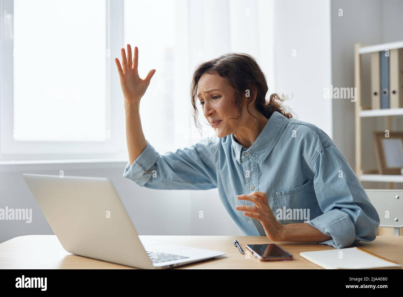 Furious angry evil beautiful curly businesswoman hates computer crash ...