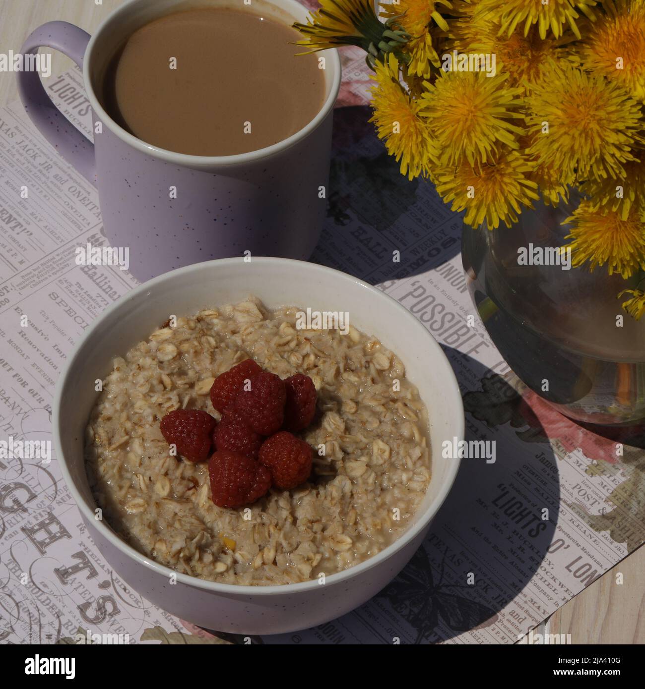 breakfast with porridge with raspberry and coffee Stock Photo - Alamy