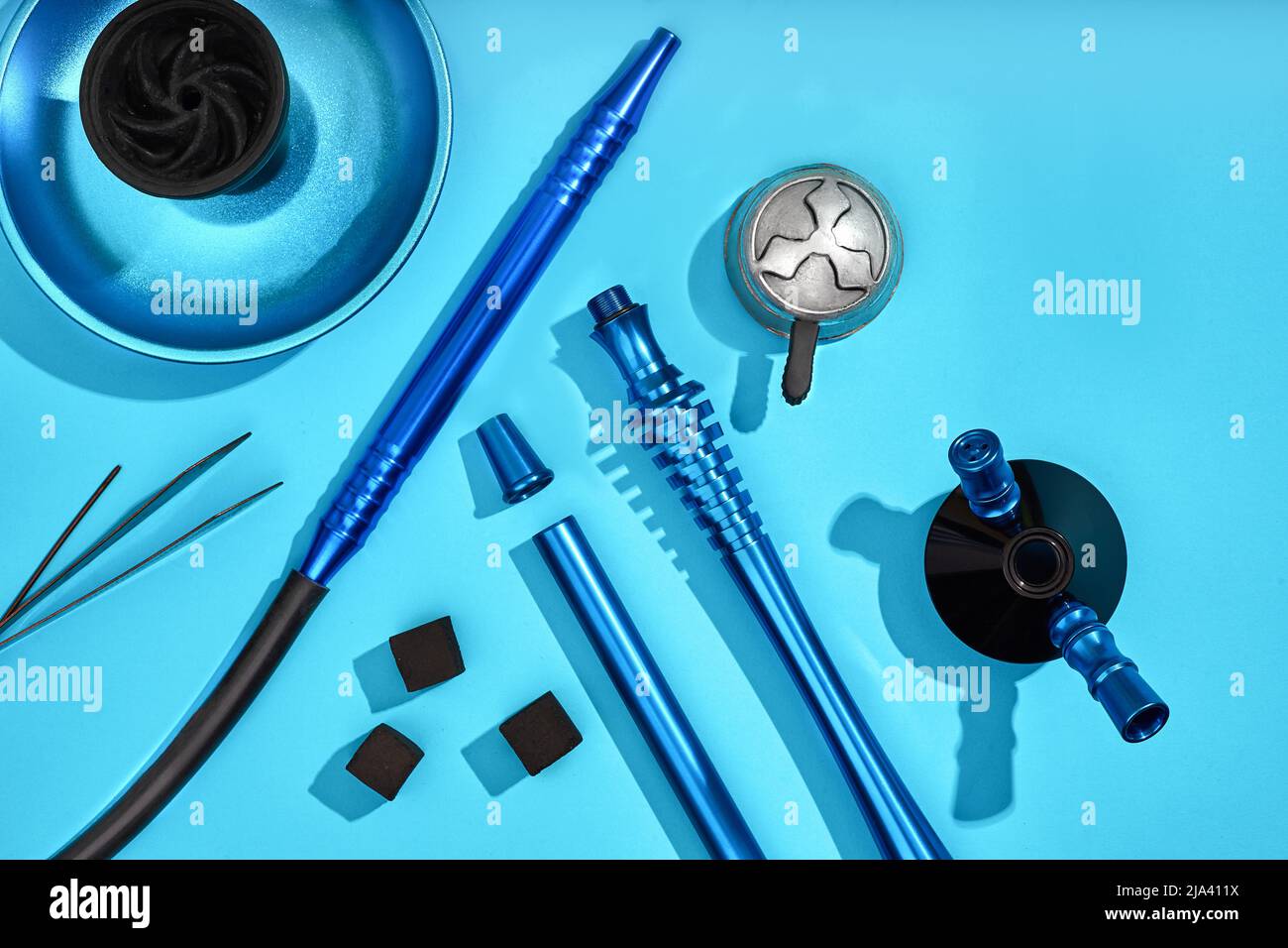 Top view of Hookah parts on light blue background Stock Photo - Alamy