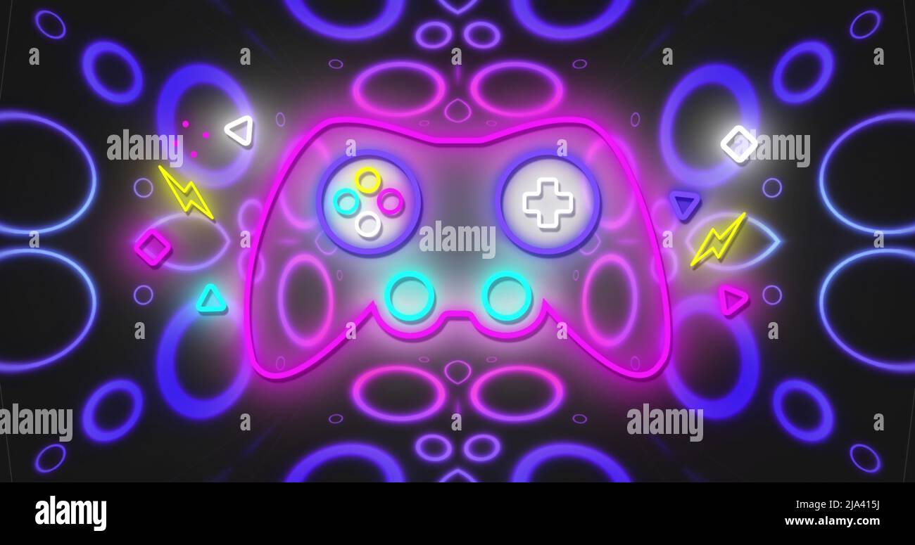 Image of neon gaming pad over neon circles and shapes on black ...