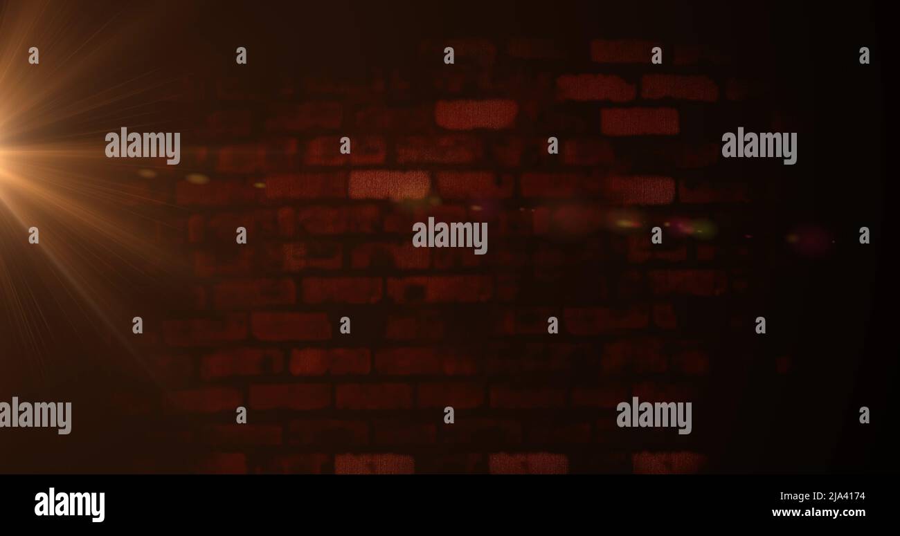 Image of light blinking over brown brick background Stock Photo - Alamy