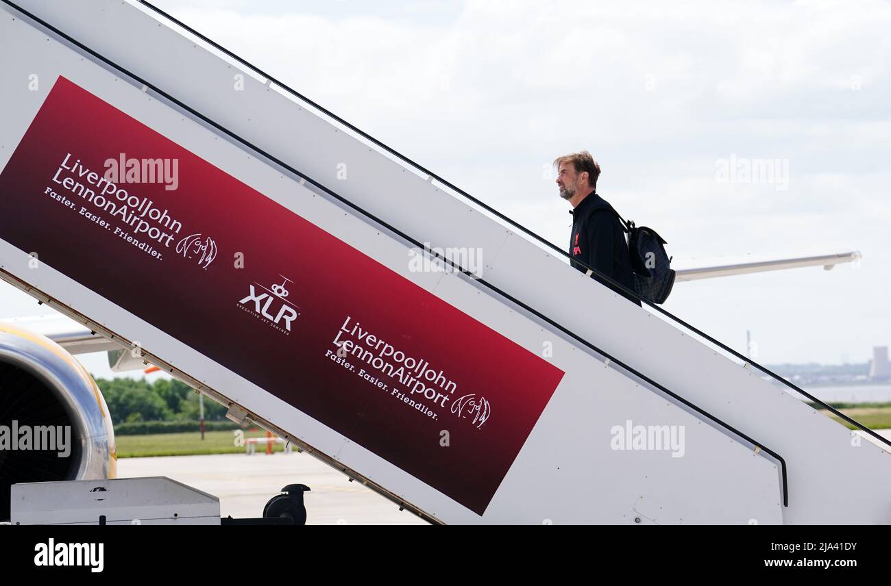 Liverpool manager Jurgen Klopp boards the plane before flying out of ...