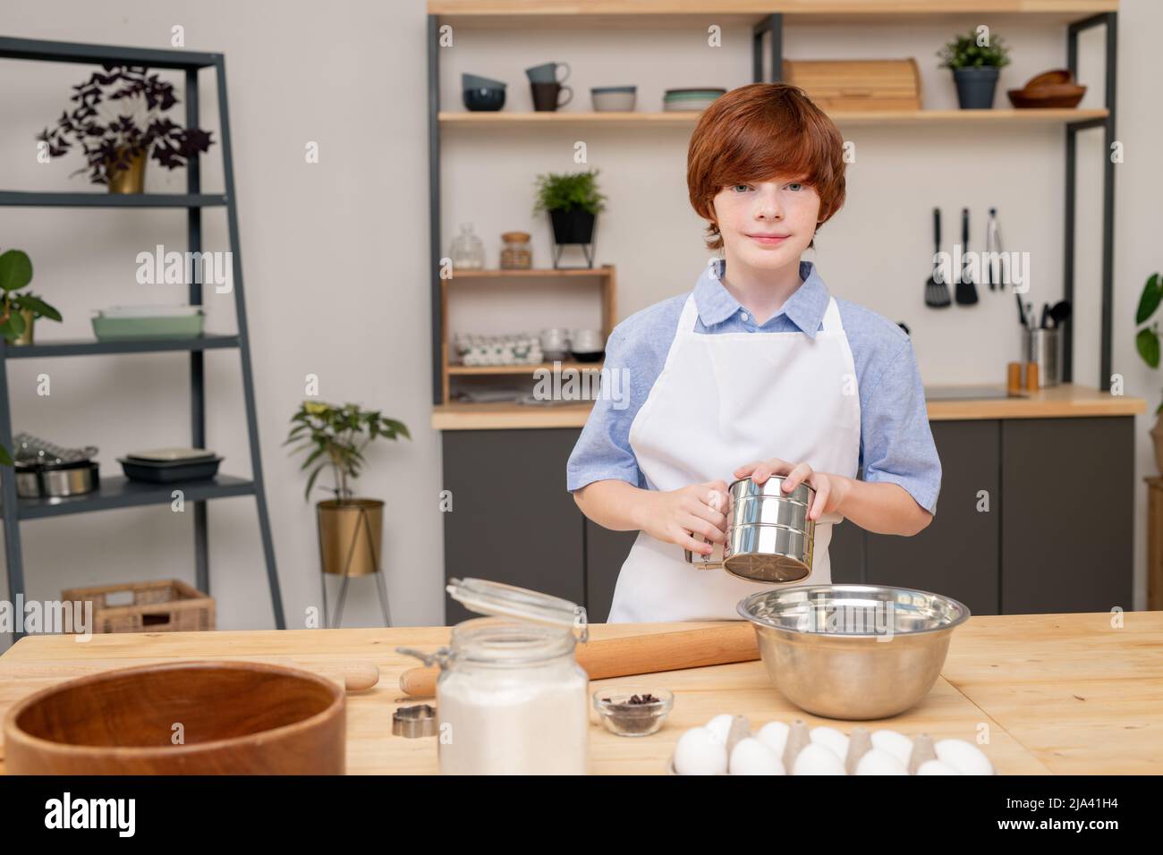 Standing looking at camera smiling preparation food and drink holding ...