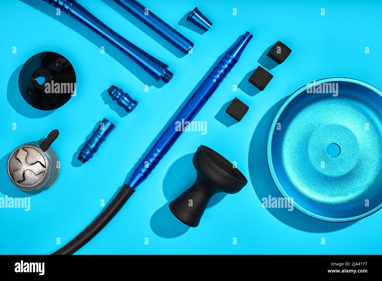 Parts of blue decorated hookah or shisha on light blue backgroun Stock ...
