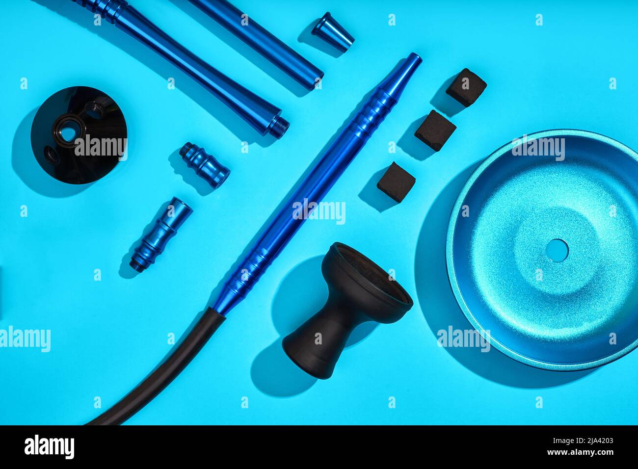 Parts of blue decorated hookah or shisha on light blue backgroun Stock ...
