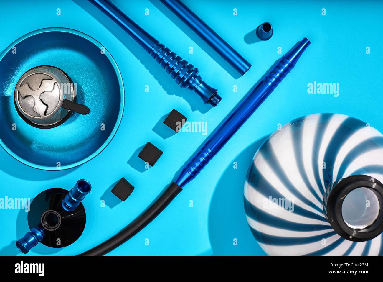 Parts of blue decorated hookah or shisha on light blue backgroun Stock ...