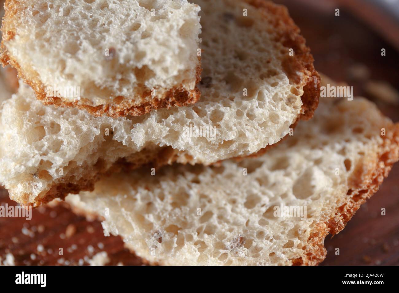 Pieces of broken bread. Homemade bread, fresh pastries in the bakery ...