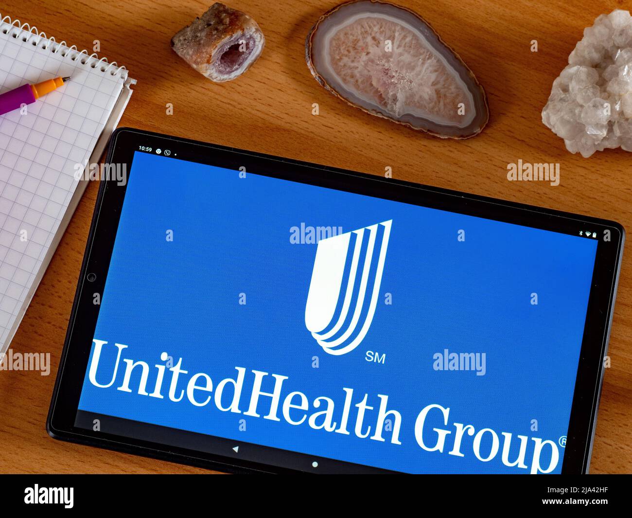 In this photo illustration, a UnitedHealth Group logo seen displayed on ...