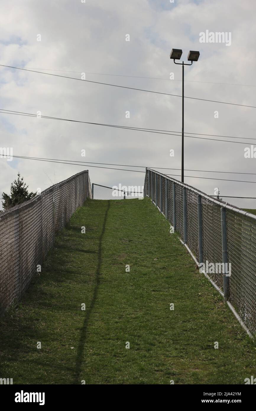 Fence going up hill hi-res stock photography and images - Alamy
