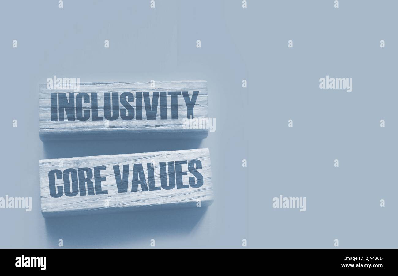 Inclusivity and core values words written on wooden blocks. Social and ...