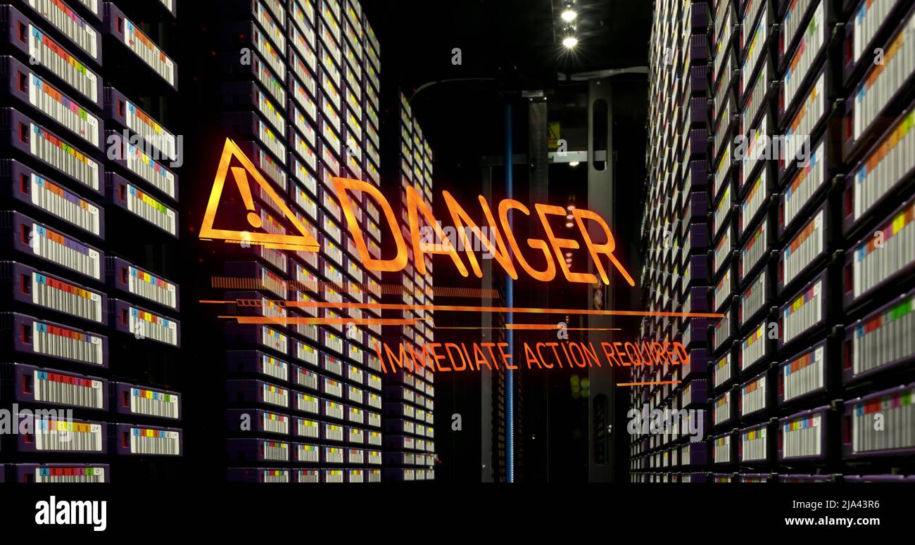 Image of danger text and symbol over server room Stock Photo - Alamy
