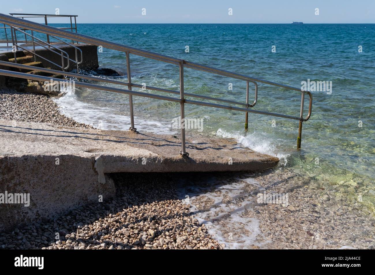 Accessible beach with ramp for people with disability using wheelchair ...
