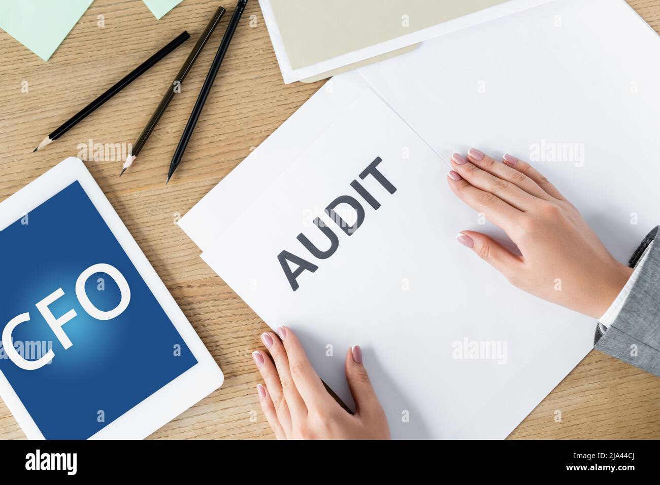 top view of businesswoman near document with audit lettering and ...