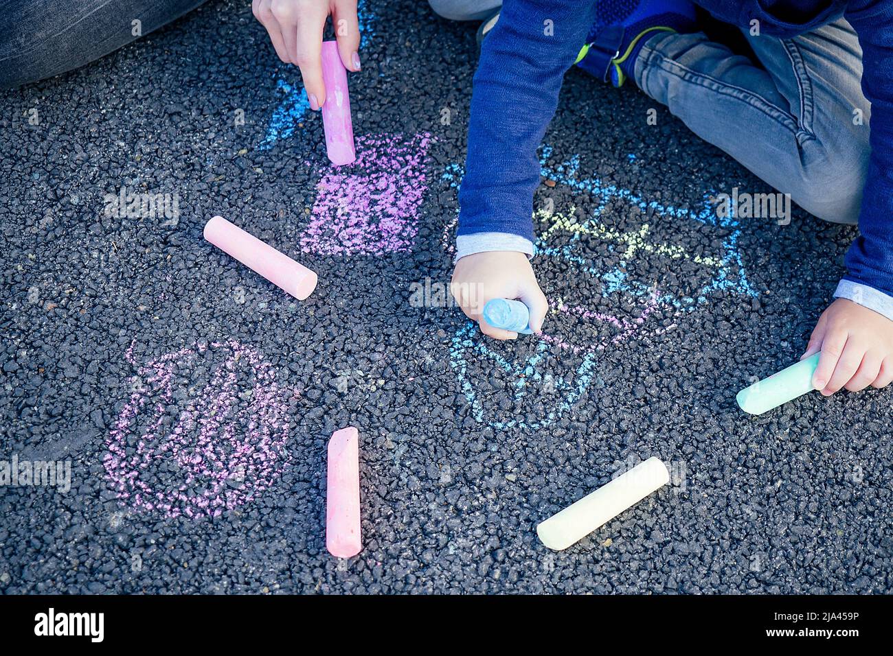 painted colored chalk crayons house, sun and grass on the asphalt Stock ...