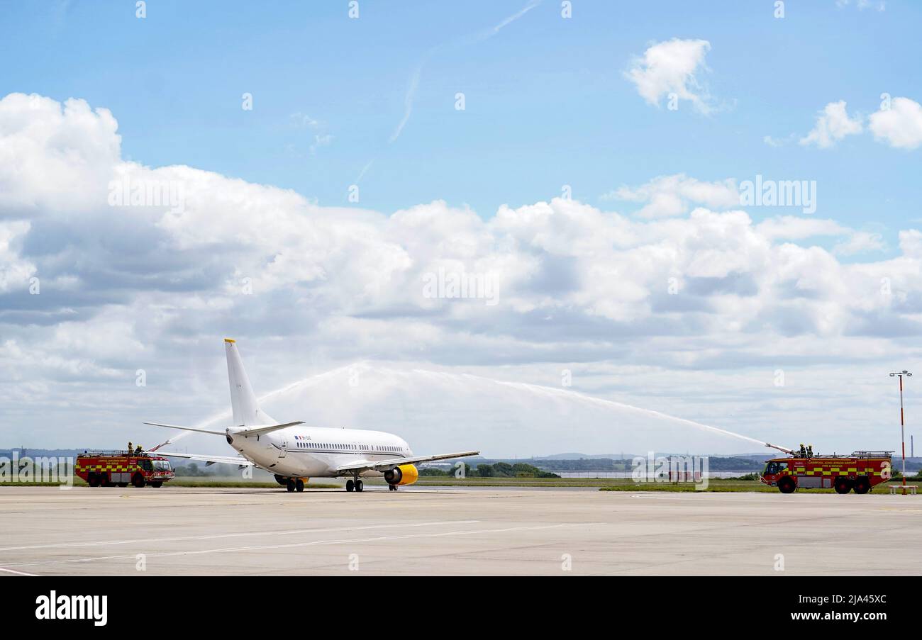 The Fire Brigade spray water cannons over the Liverpool plane before it ...
