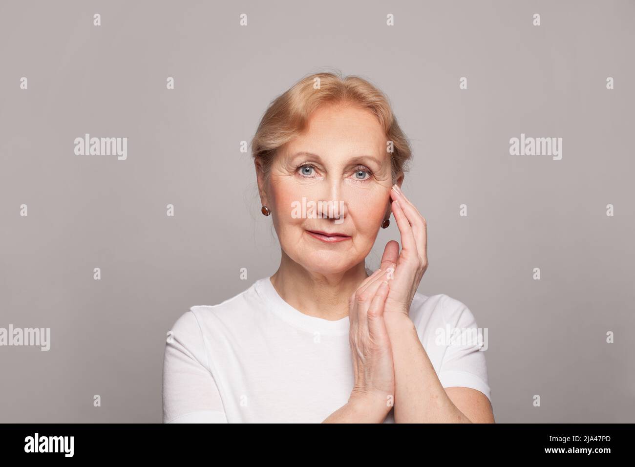 Beautiful age woman looks with an affectionate look. A healthy woman at ...