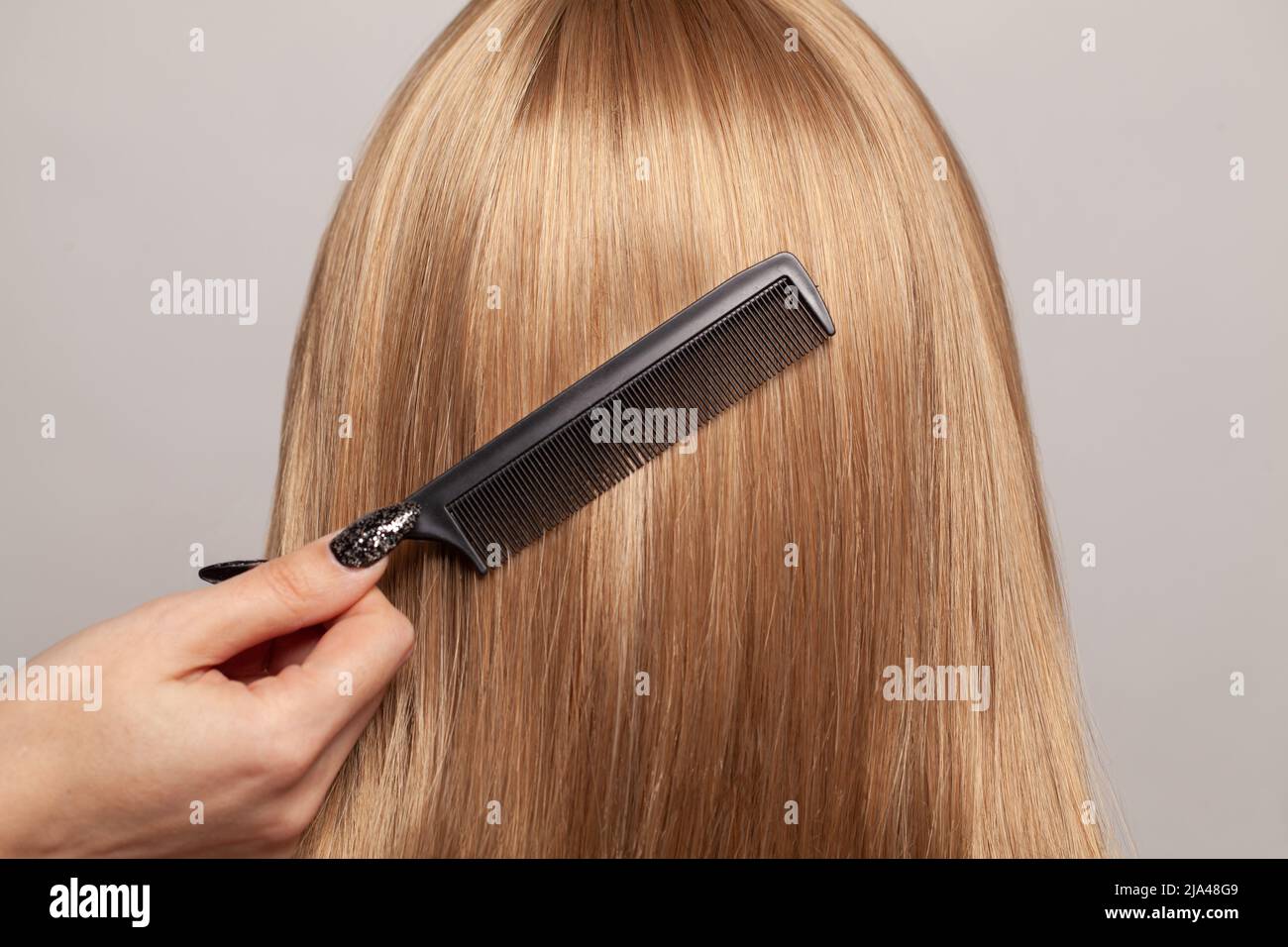 Woman thick hair beauty comb hi-res stock photography and images - Alamy