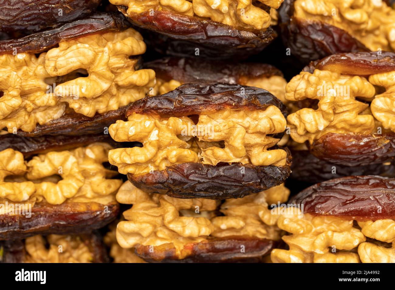 Walnut date fruit. Walnut filled dates healthy food. Close-up. local ...