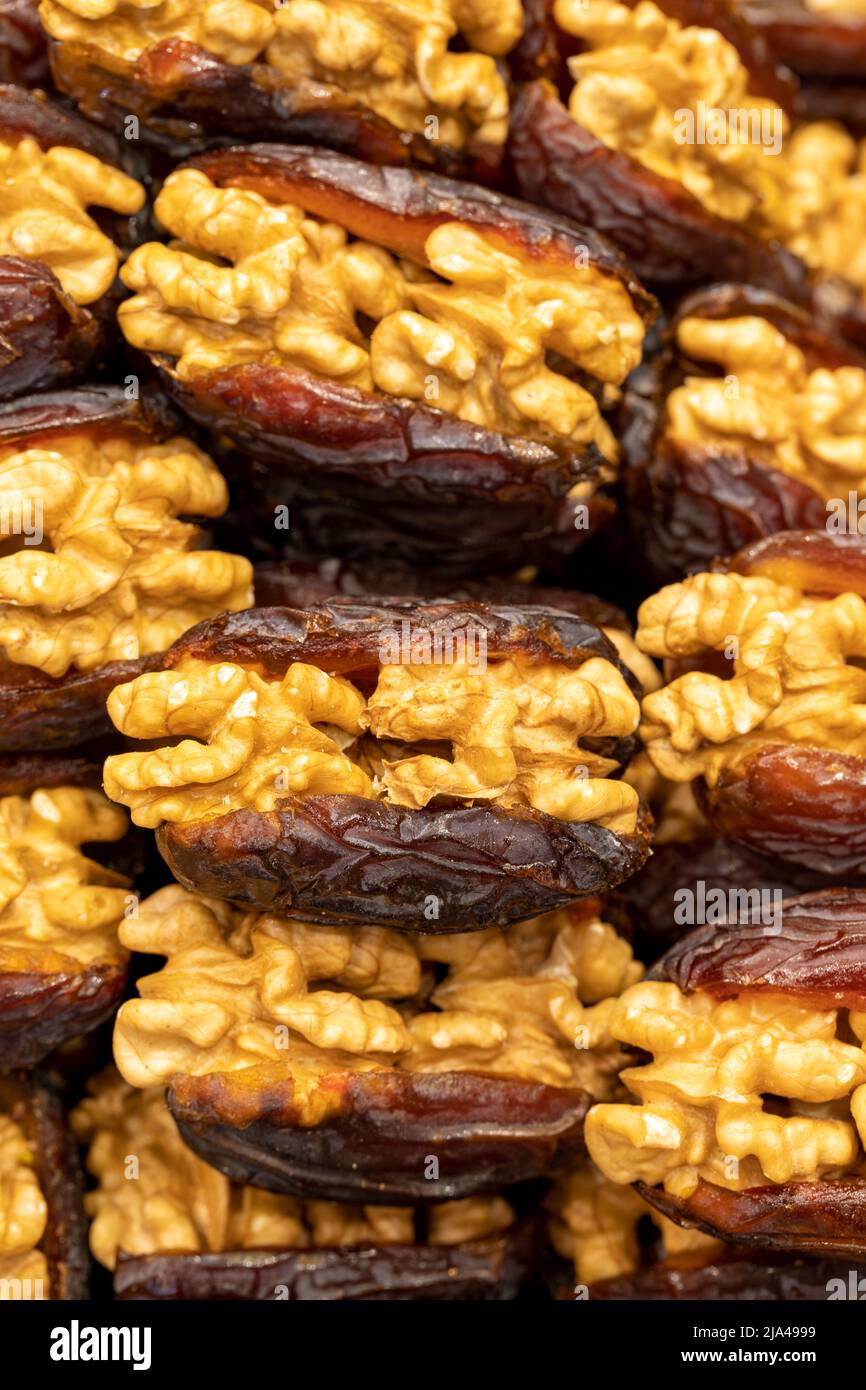 Walnut date fruit. Walnut filled dates healthy food. Close-up. local ...