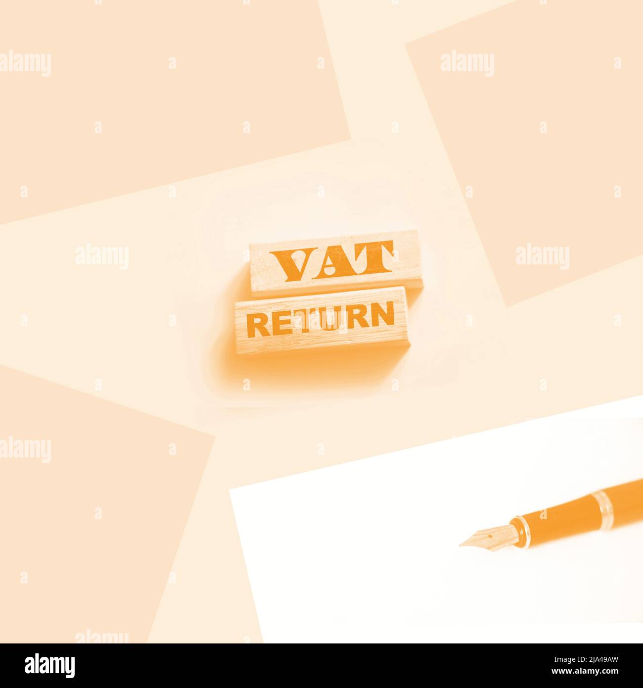 VAT return text Value Added Tax return on wooden blocks on pink ...