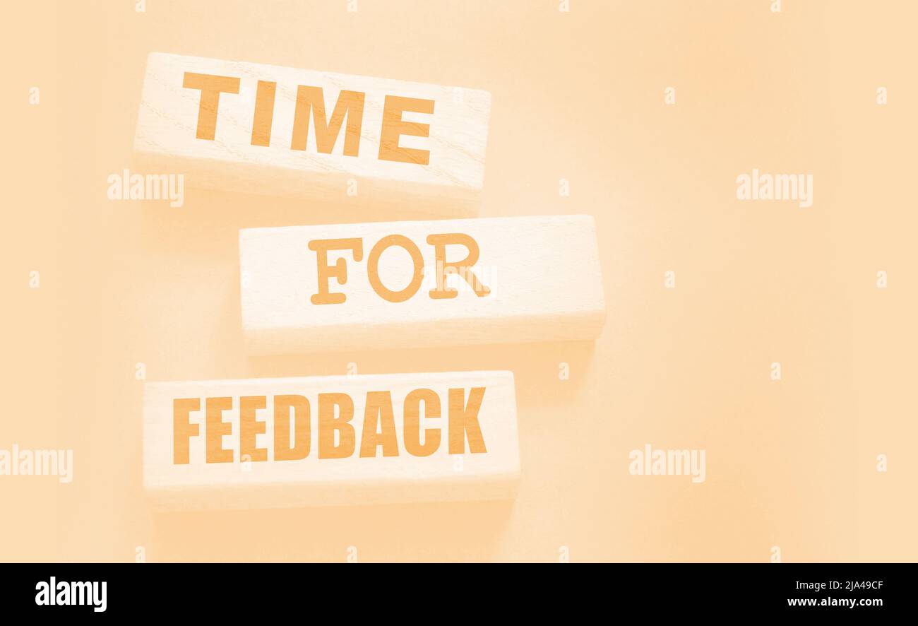 Time fir feedback text on wooden blocks. Product or service evaluation ...