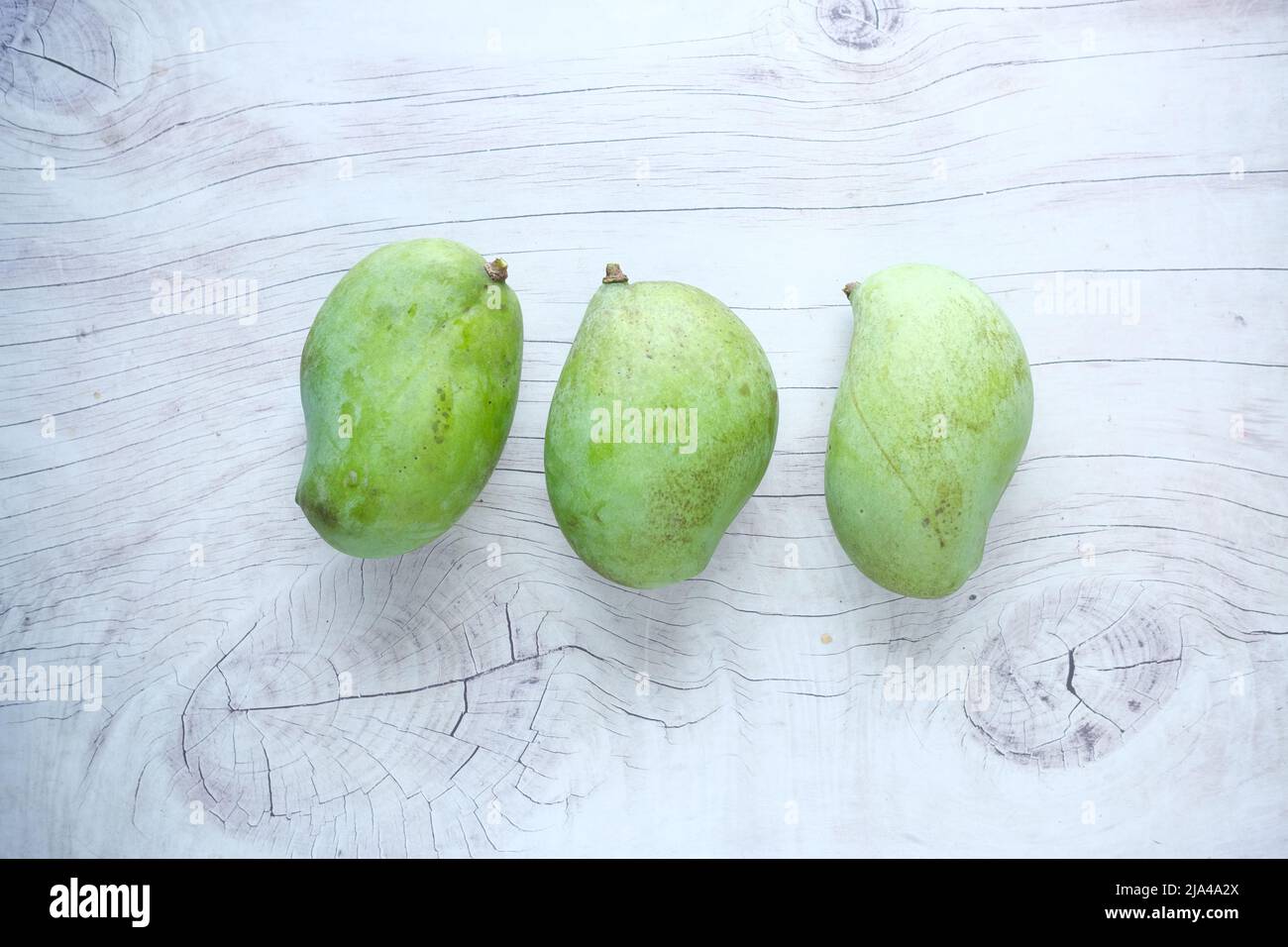 Fresh big size green mango on black wooden background top down Stock ...