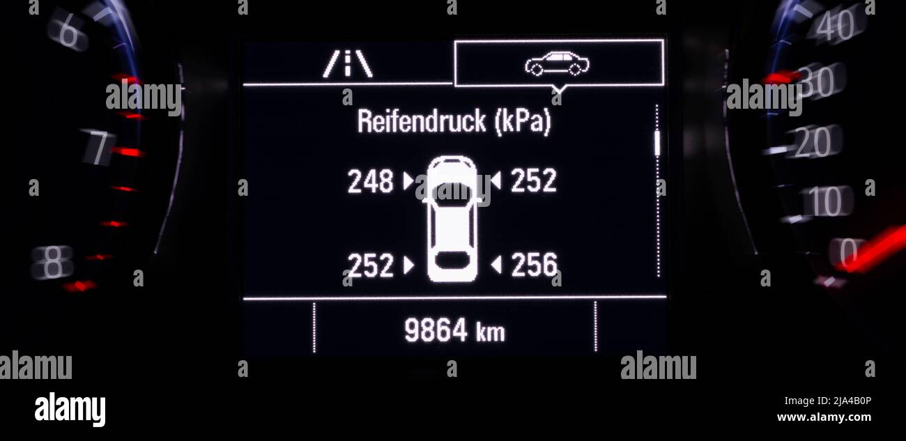 Info display in modern cars with tire pressure display Stock Photo - Alamy