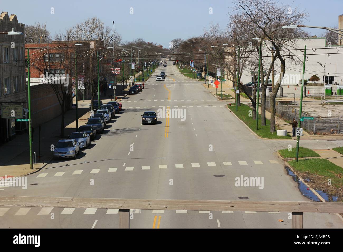 Standard typical inner city neighborhood with cars, apartment buildings ...
