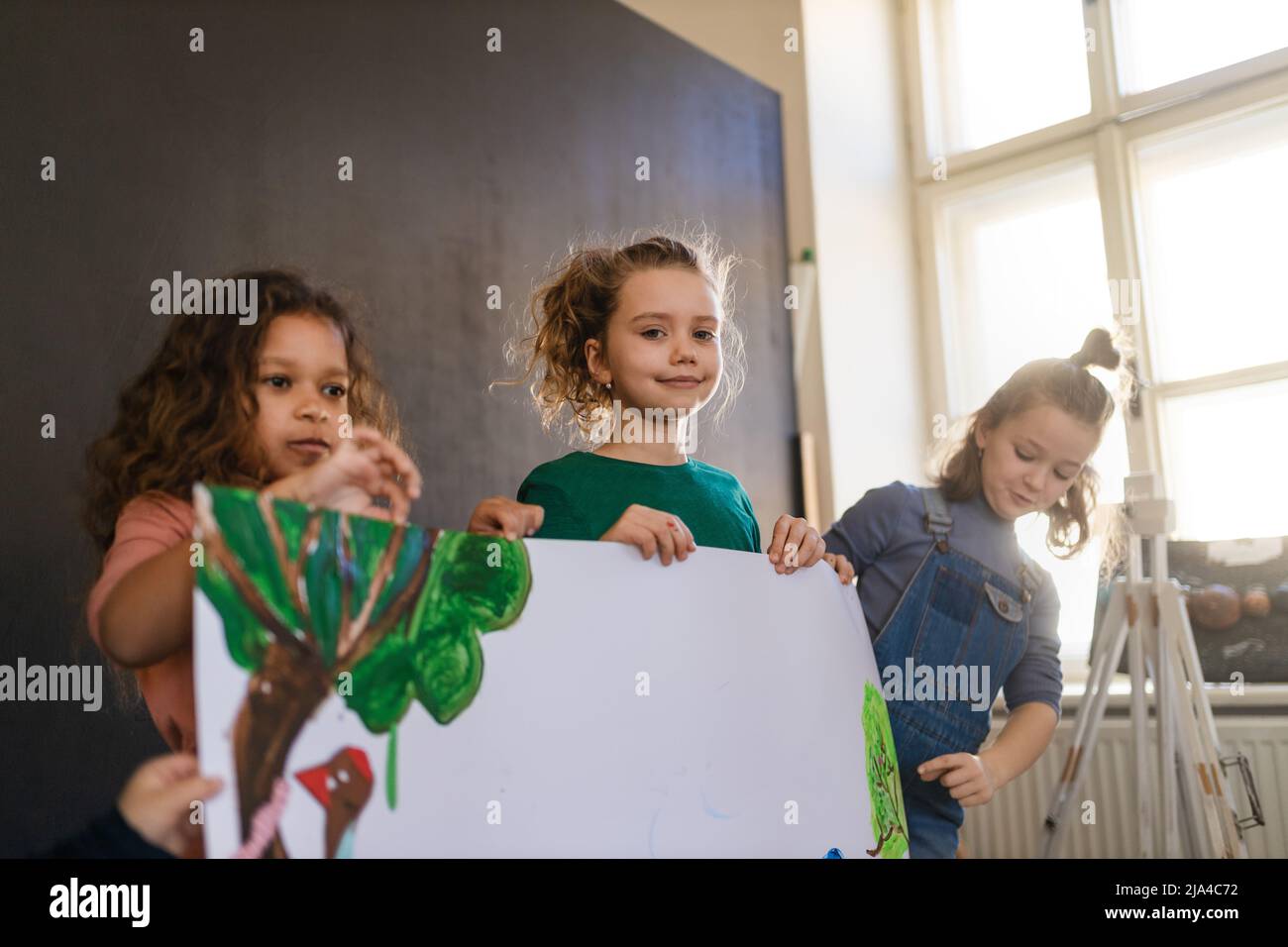 Children hold paint class hi-res stock photography and images - Alamy