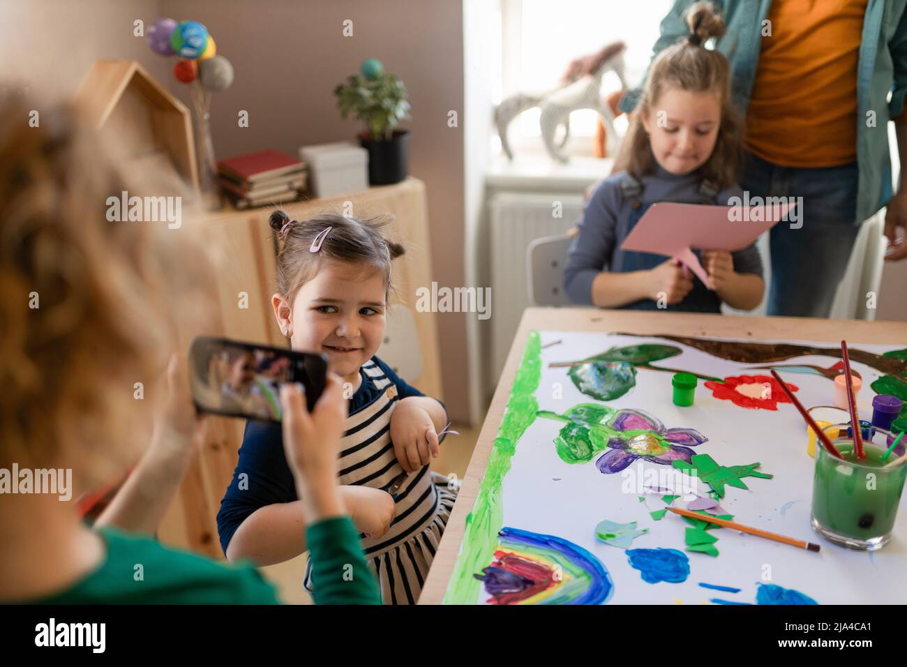 Group of little kids working on project during creative art and craft ...