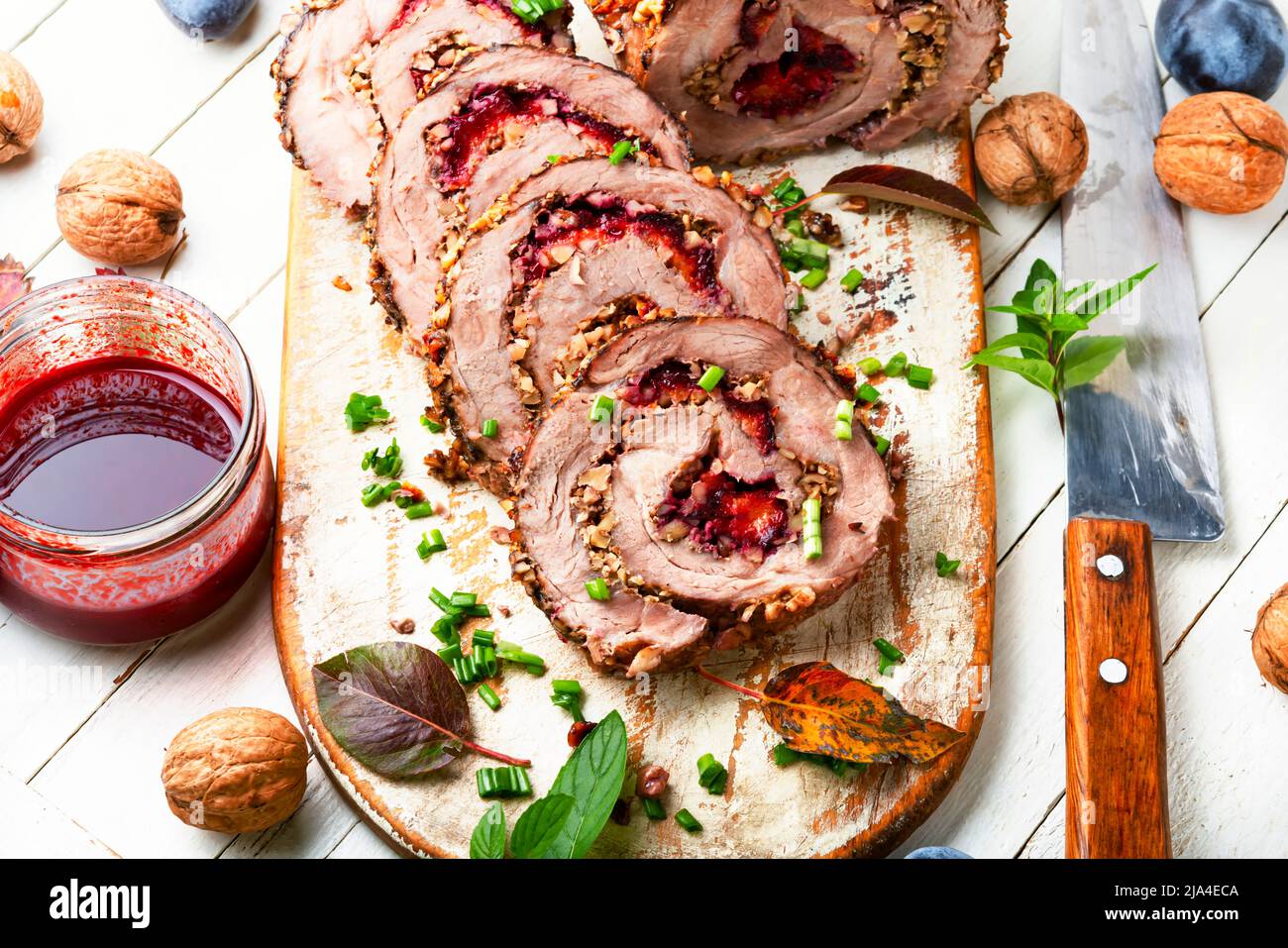 Slice meatloaf baked with autumn plum and nuts.Festive meat roll Stock ...