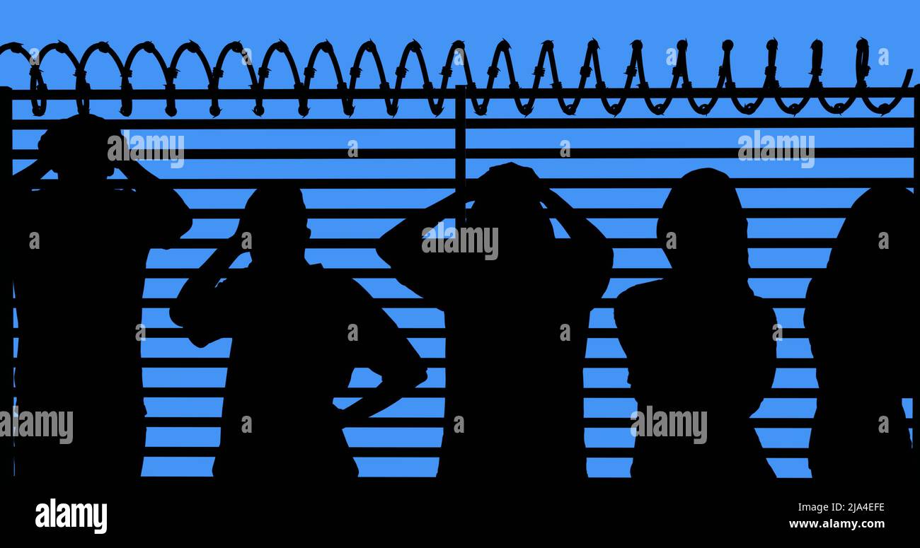 Image of people stating in front on the fance Stock Photo - Alamy