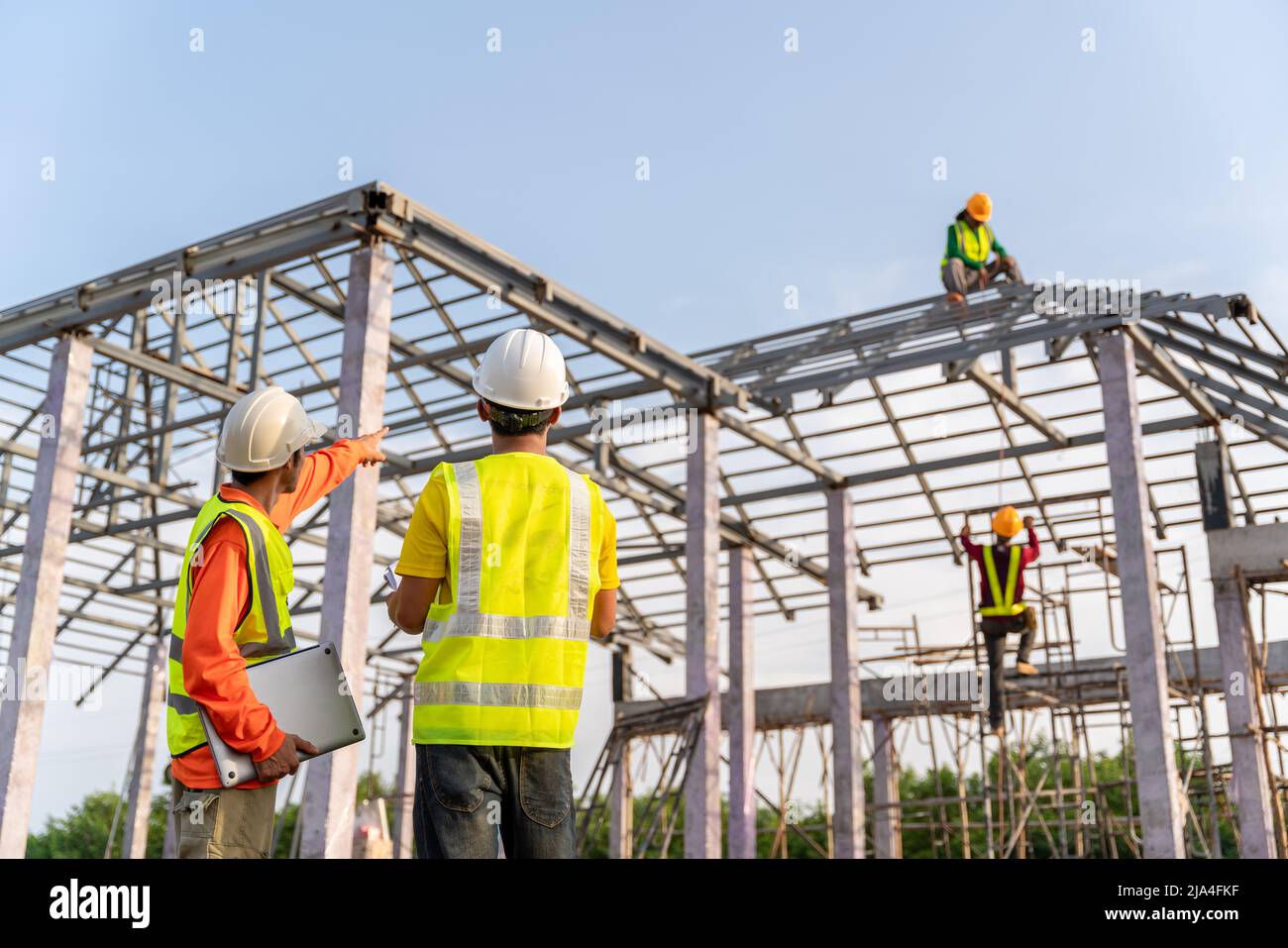 4 Workers in Construction Site, Architect and engineer watching ...