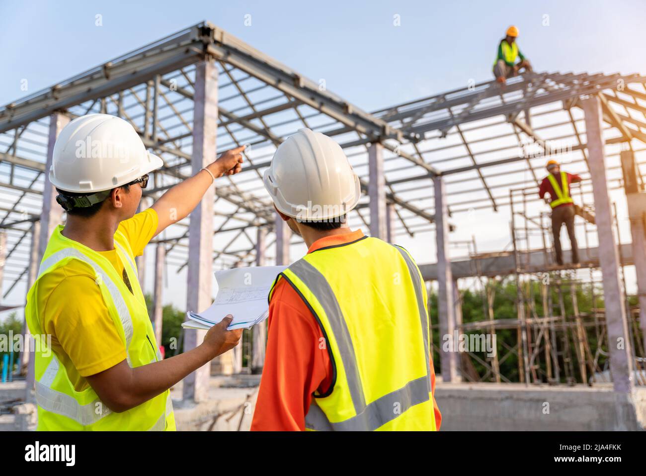 4 Workers in Construction Site, Engineer technician watching team of ...