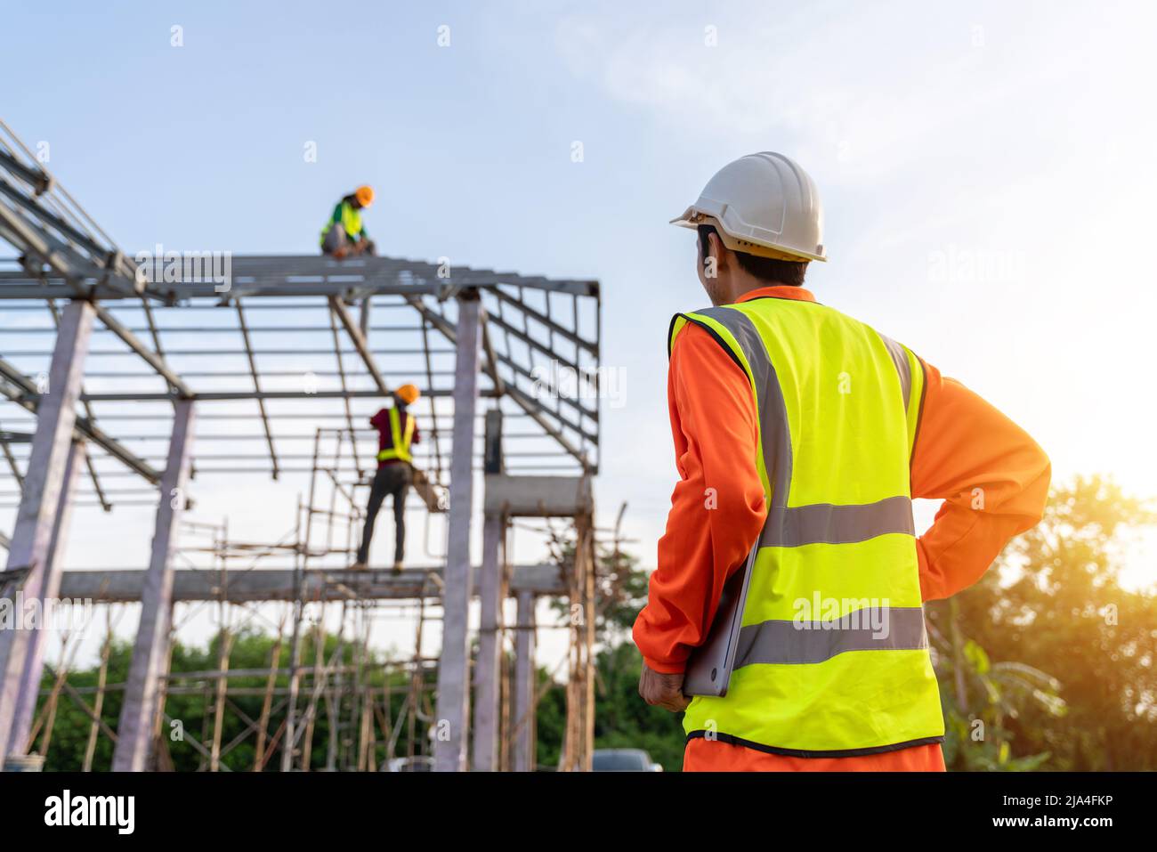3 Workers in Construction Site, Engineer technician watching team of ...