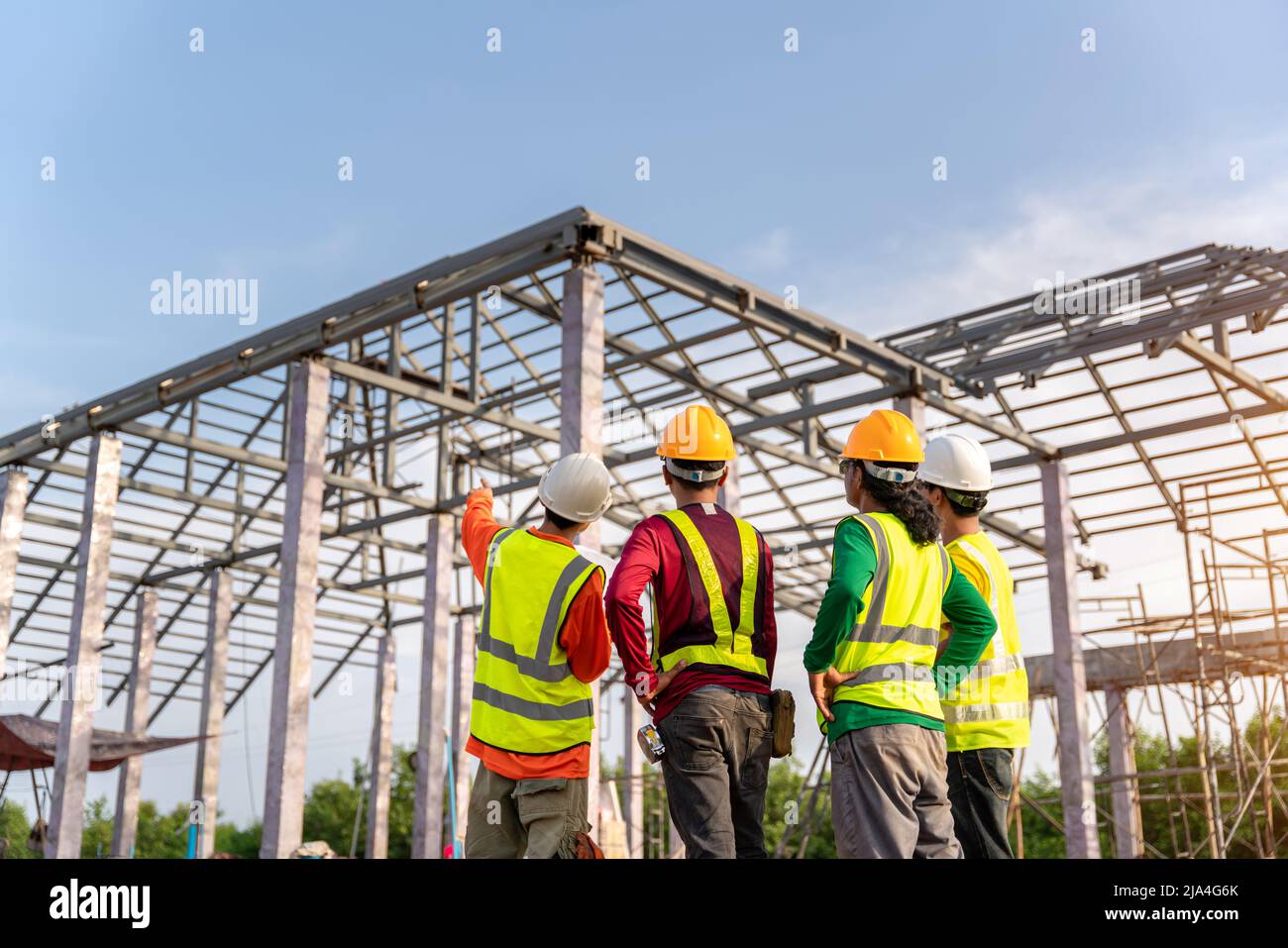 4 Workers in Construction Site, Contractor with workers and Steel roof ...