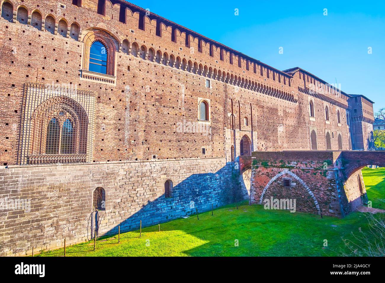 The huge defensive walls and deep dug moat surrounding Sforza's Castle ...