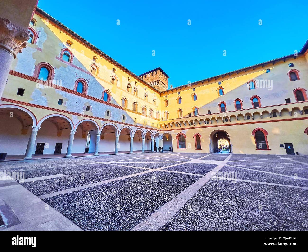 The large medieval Rocchetta square courtyard with pebbled floor ...