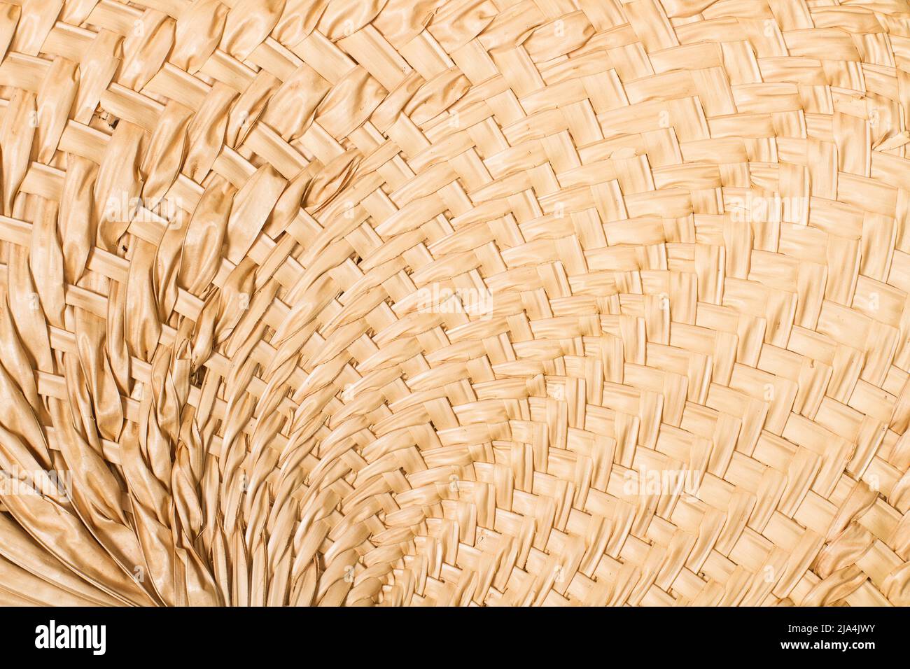 A straw pai pai fan in a close up view Stock Photo - Alamy
