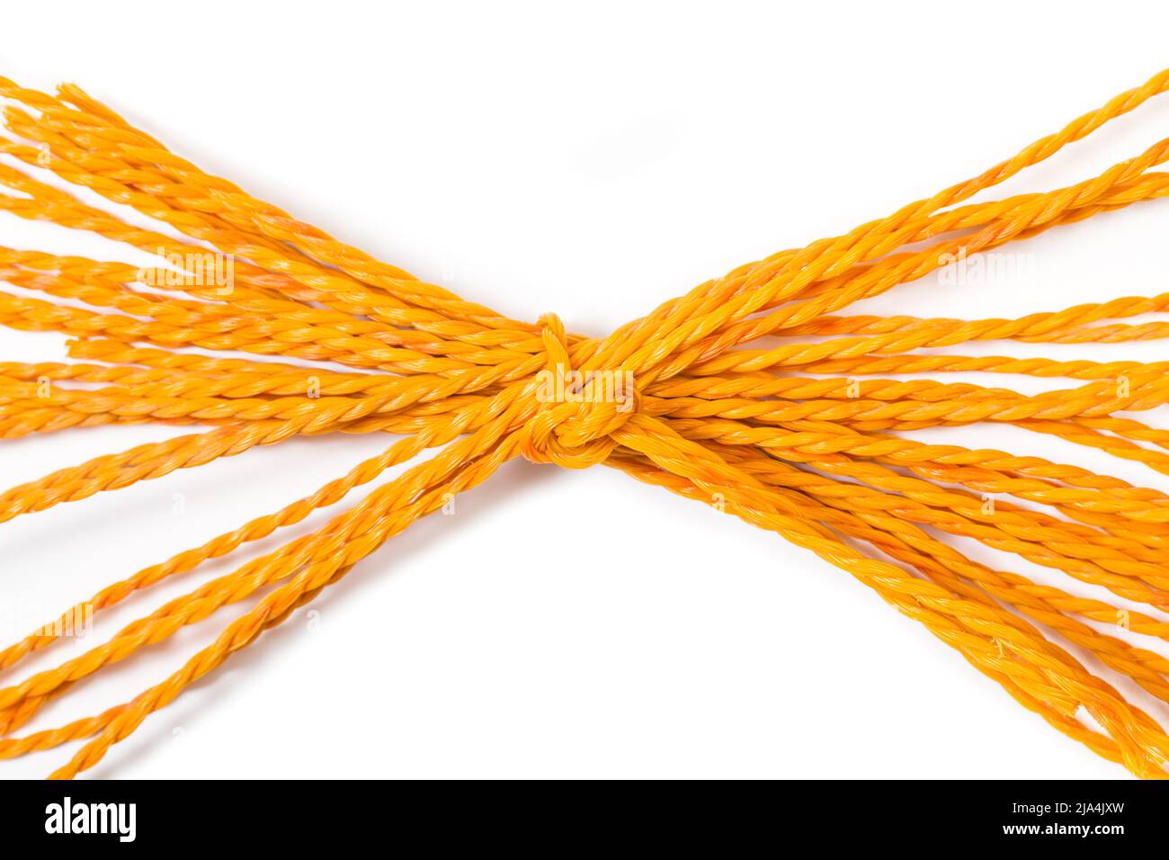 Orange plastic tied ropes on a white background Stock Photo - Alamy
