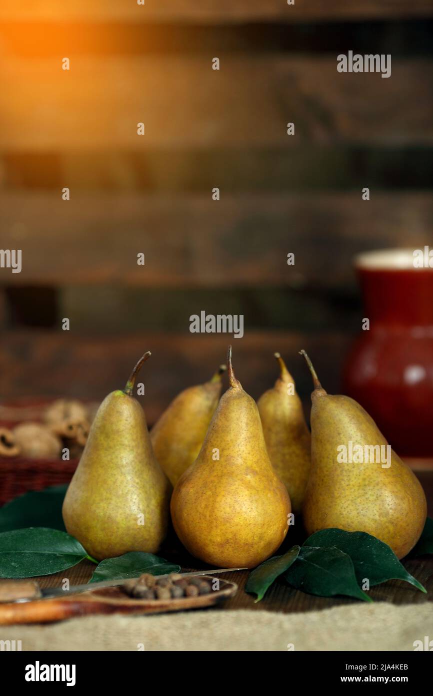 A group of ripe pears lie on old wooden boards Stock Photo - Alamy